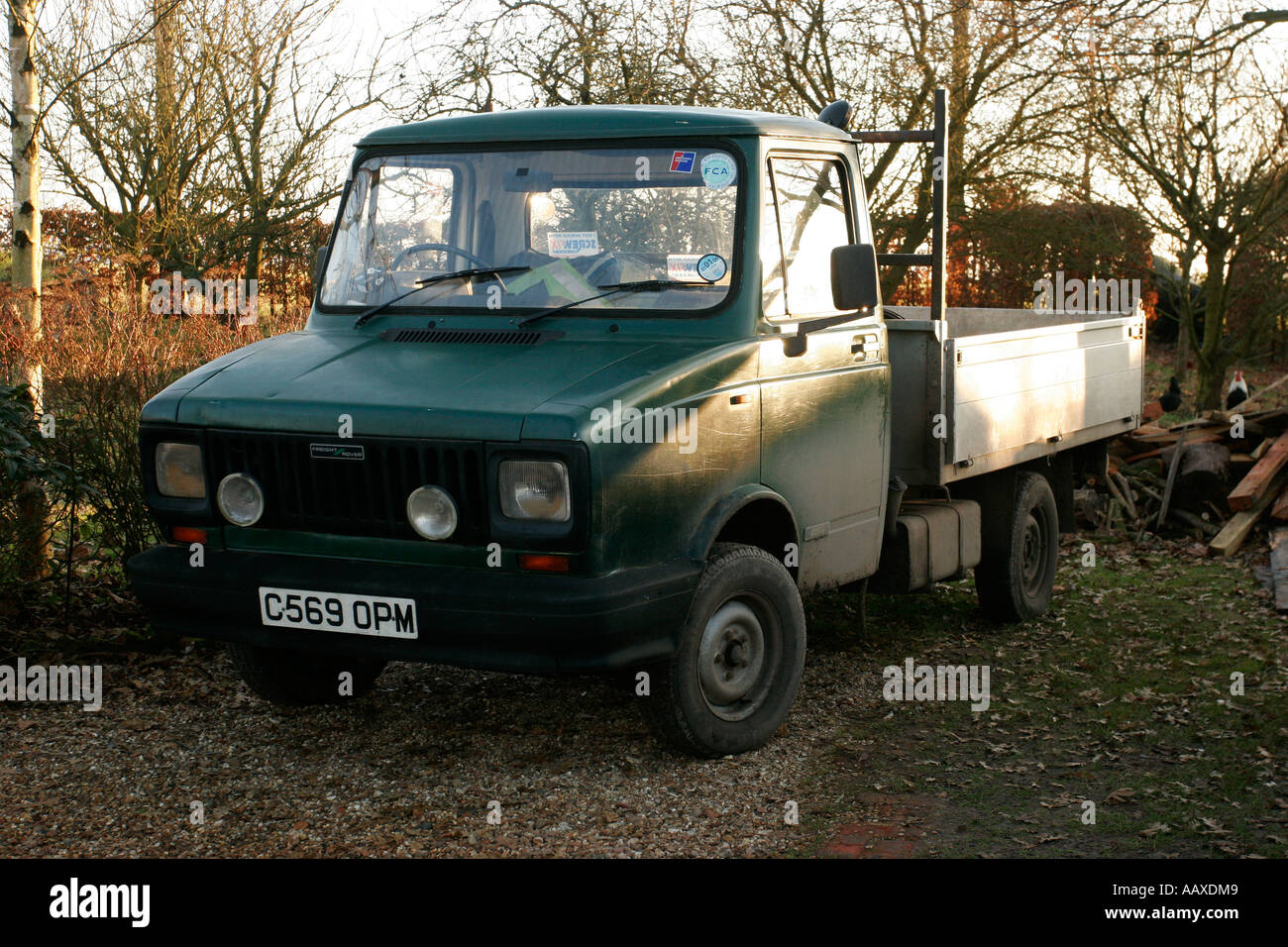 Green builders van or tip up truck Hampshire England UK Stock Photo - Alamy