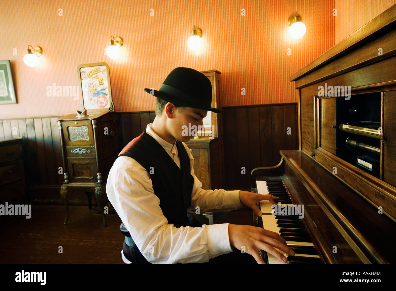 Man playing vintage piano Stock Photo - Alamy