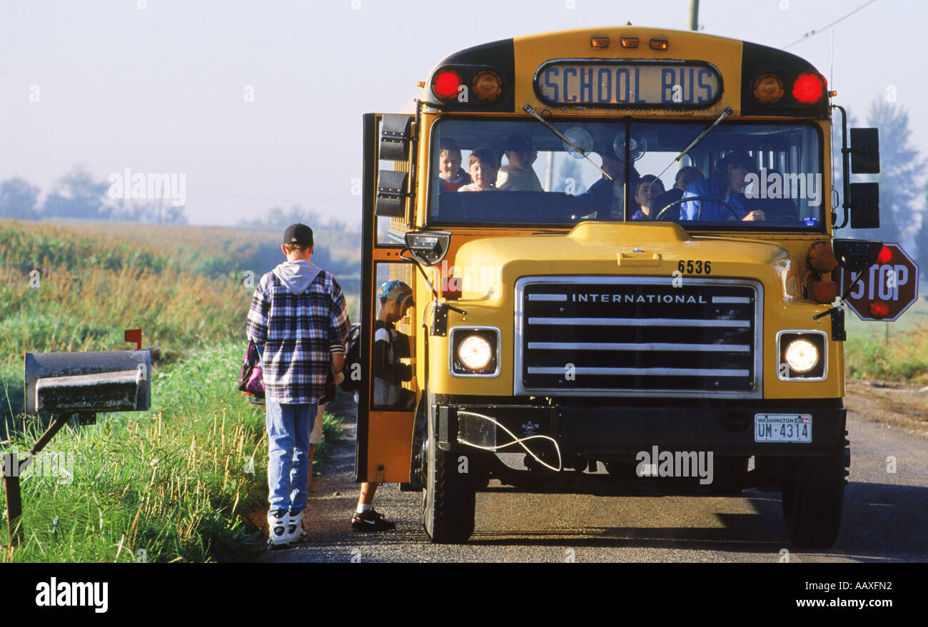 Children boarding a yellow school bus in Northwest USA Stock Photo - Alamy