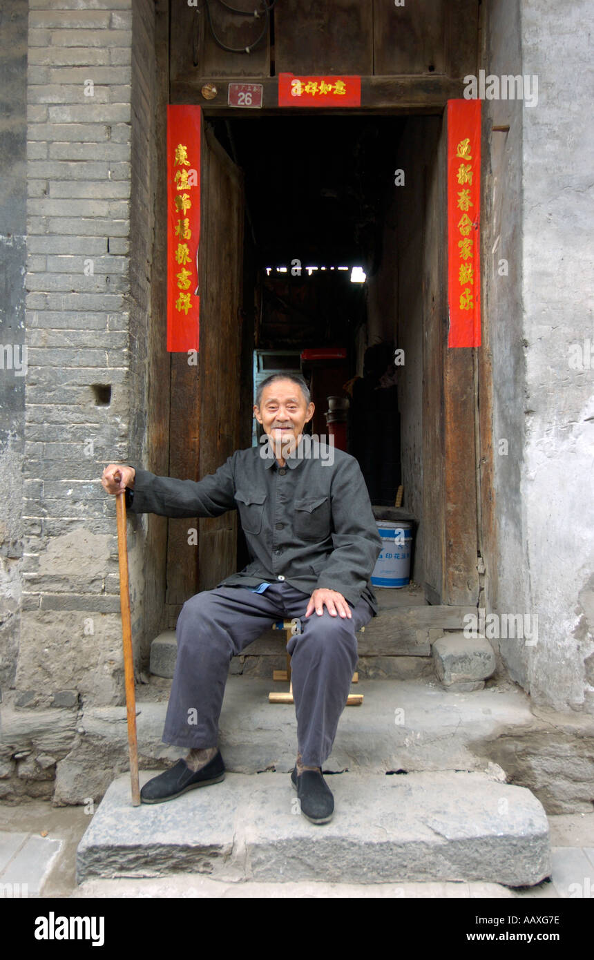 Man sitting outside house china hi-res stock photography and images - Alamy