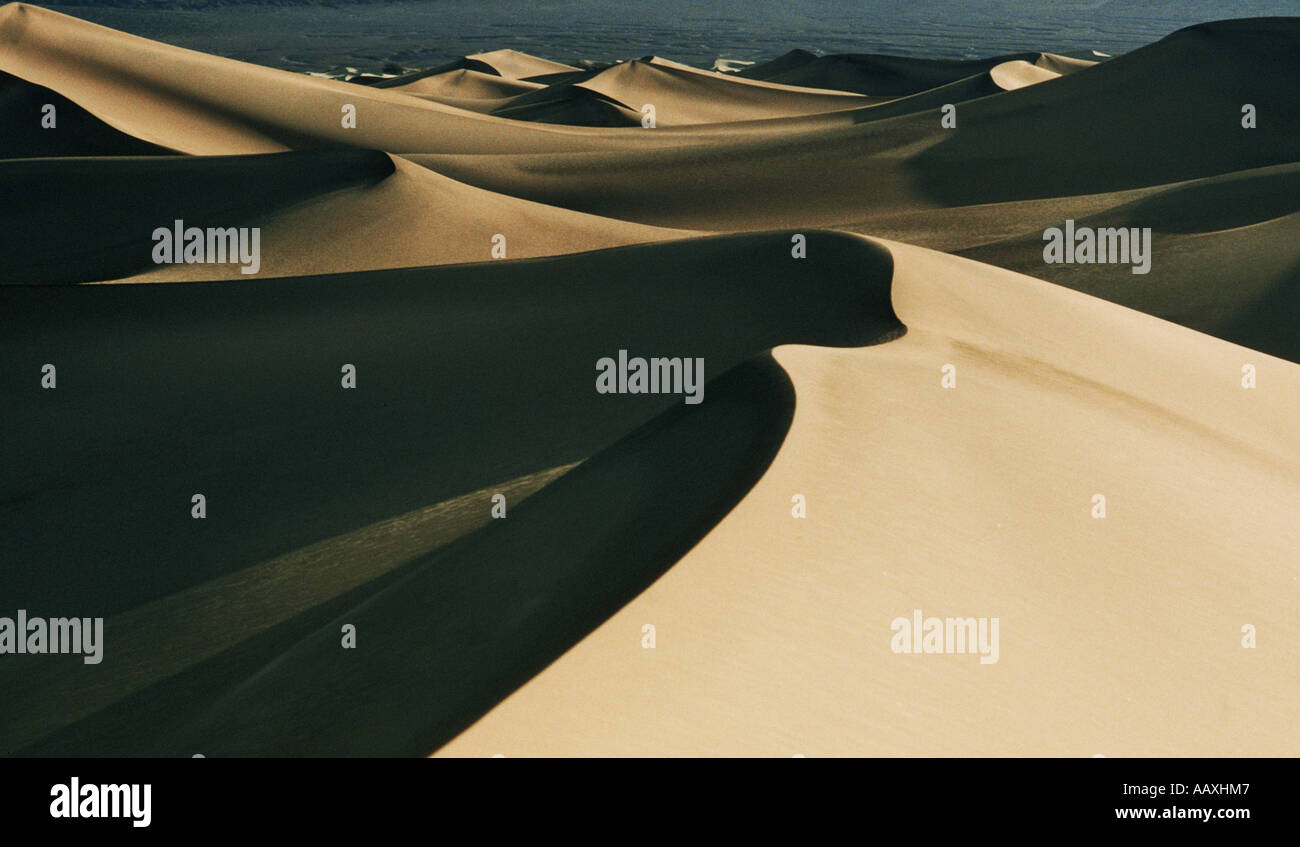 Shadows across sand dunes in low light Stock Photo - Alamy