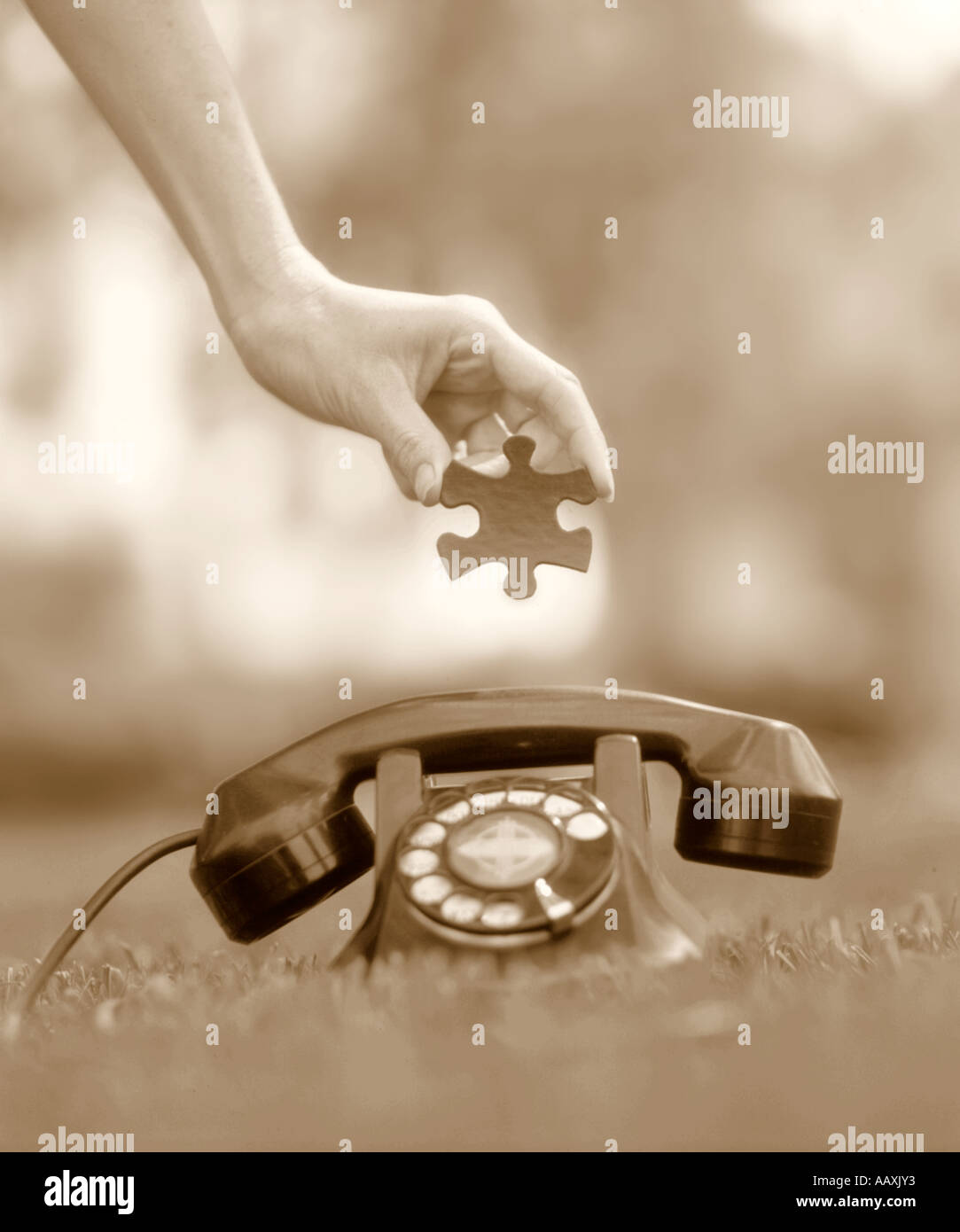 hand places puzzle piece into phone Stock Photo - Alamy