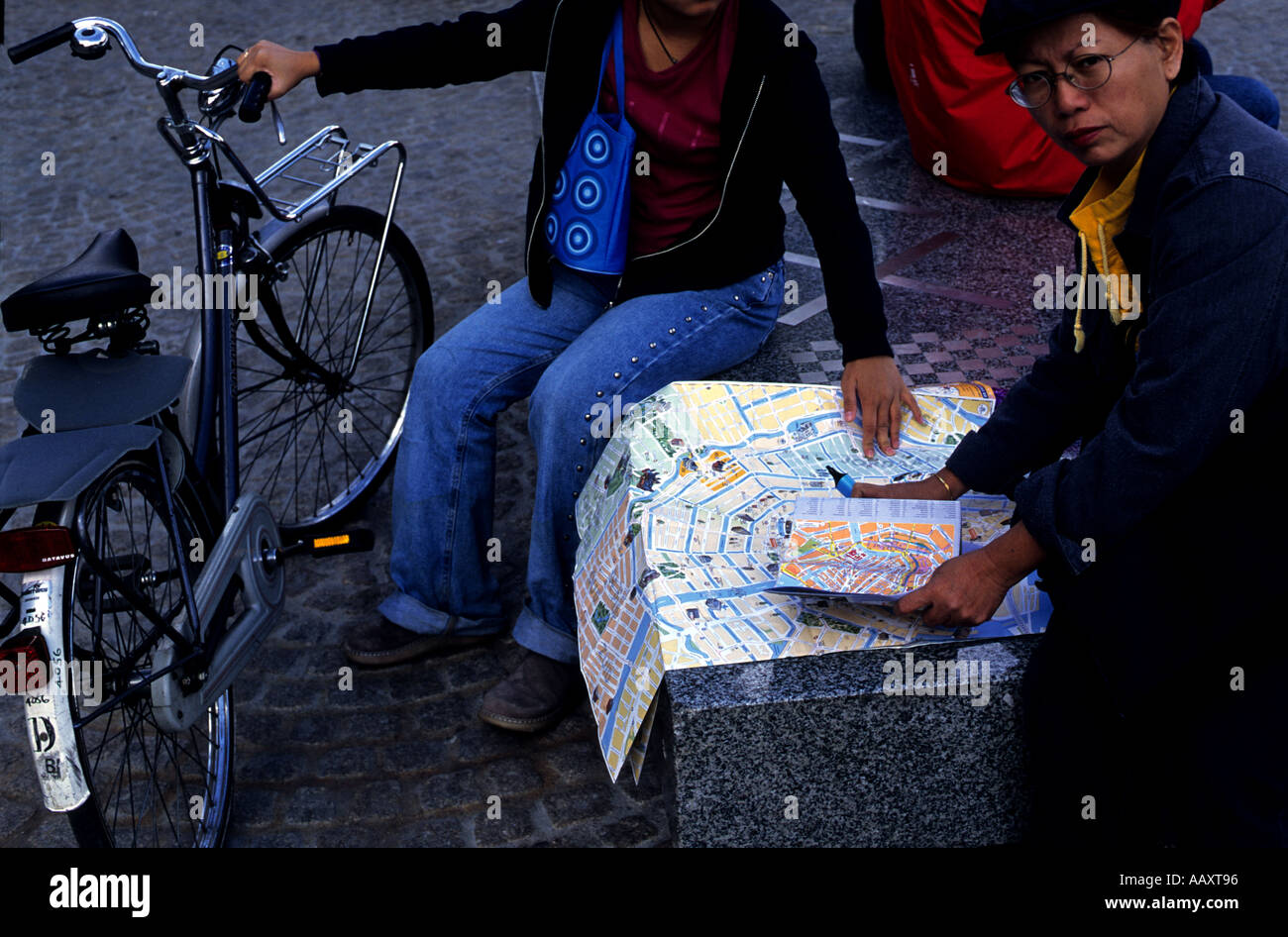 Tourists looking at maps in Dam Square Amsterdam Holland Stock Photo ...