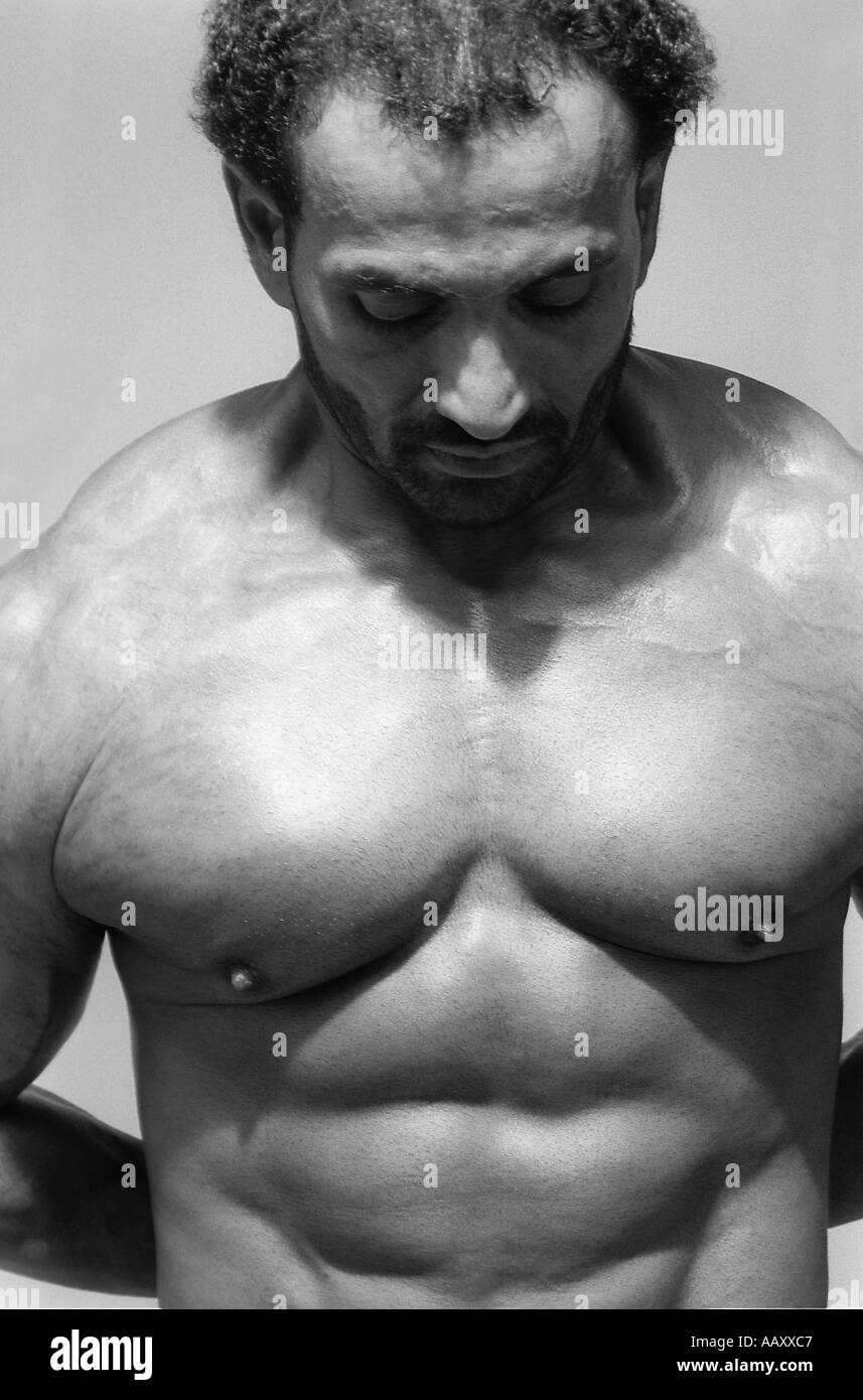 Bodybuilder flexing stomach muscles - Model Release Number 624 Stock ...