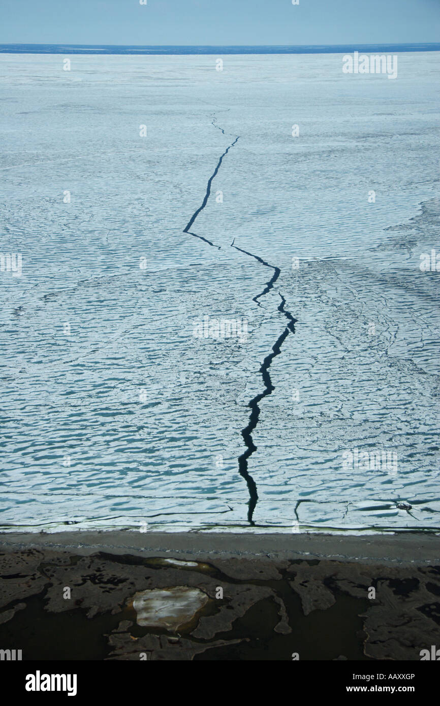 A crack in the sea ice of the Arctic Ocean on the coast of the Arctic ...