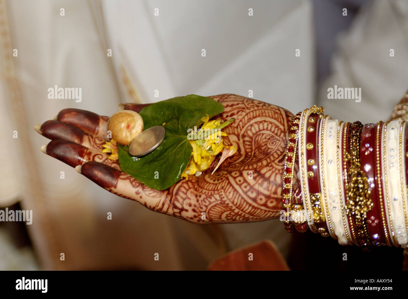 South Asian Indian Bride with mehndi heena hands holding pan betel nut ...