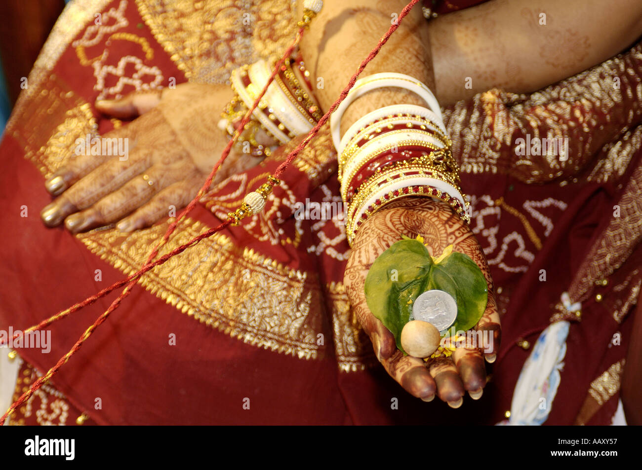 Indian wedding ceremony, bride holding betel leaf and areca nut and ...