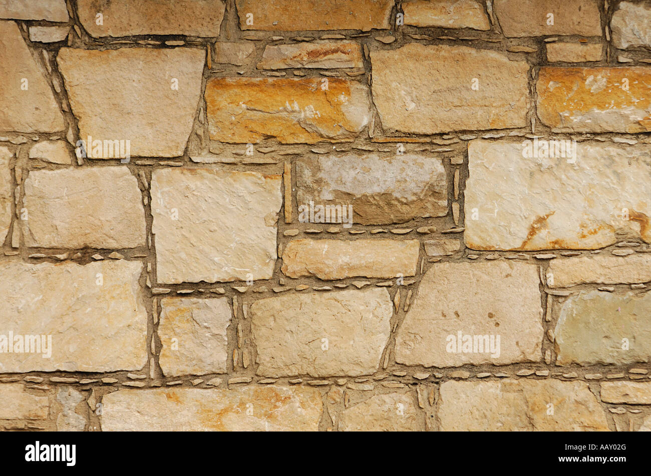 Stone wall sandstone background texture Stock Photo - Alamy