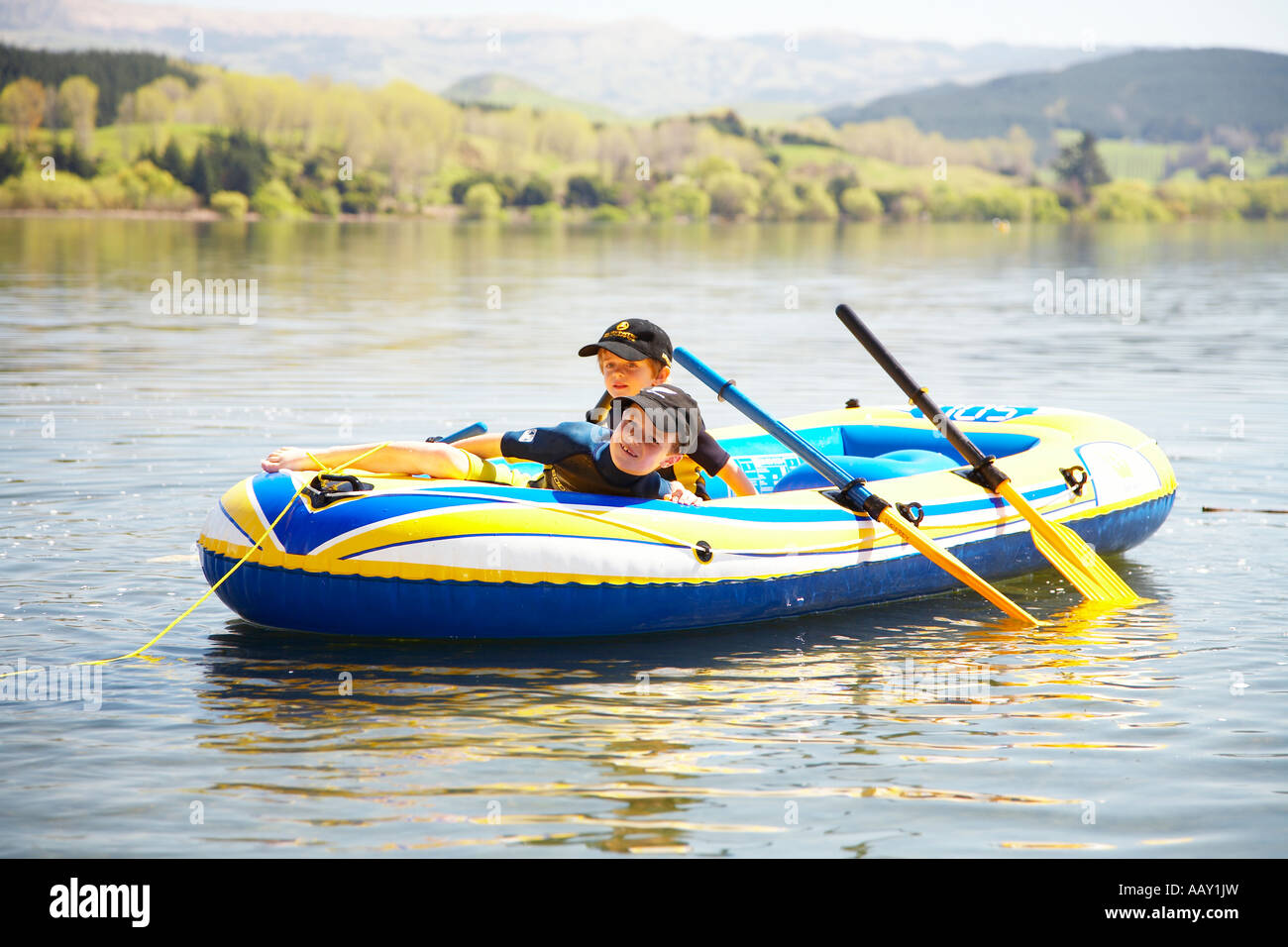 Children playing in inflatable boat hi-res stock photography and images ...