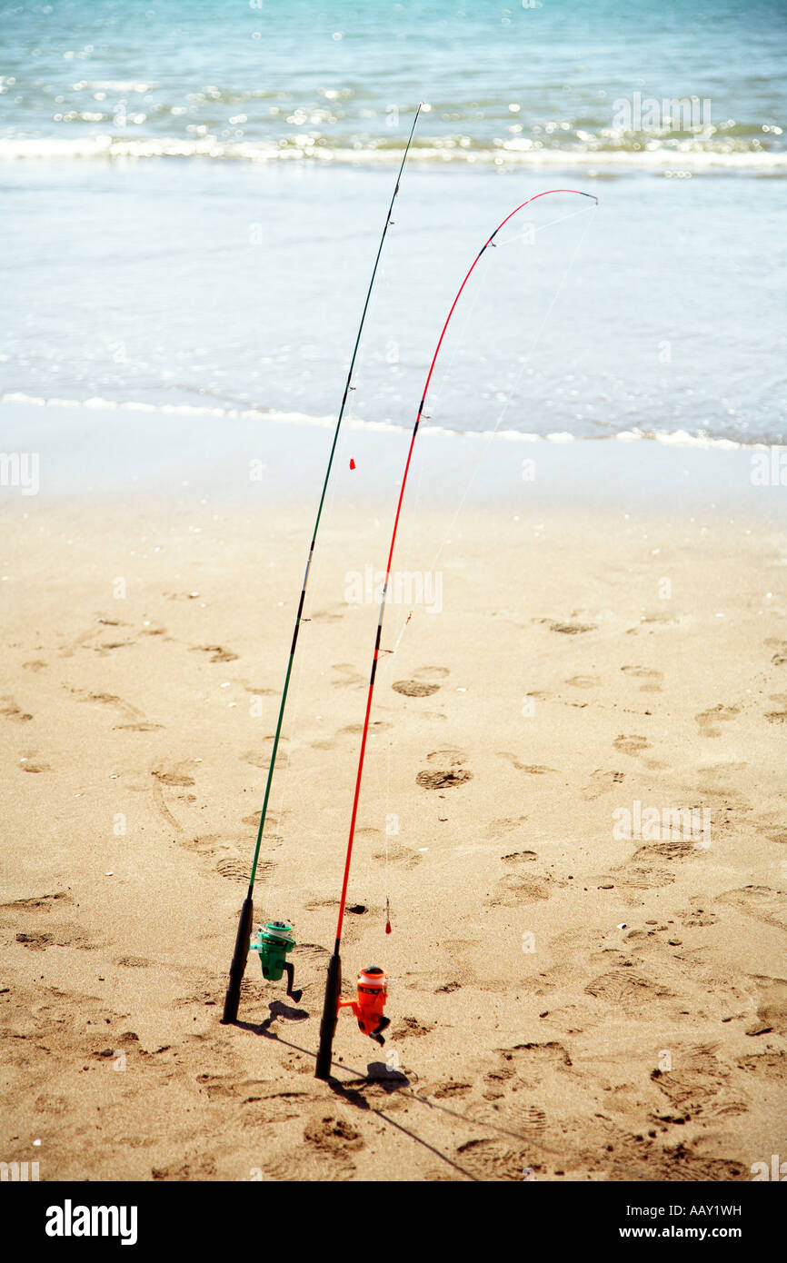 two kids fishing rods on beach Stock Photo - Alamy