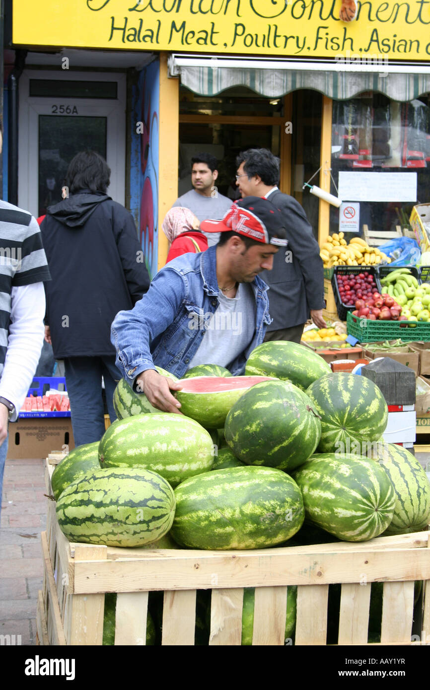 Man selling big watermelons. Cowley Road carnival, Oxford, England ...