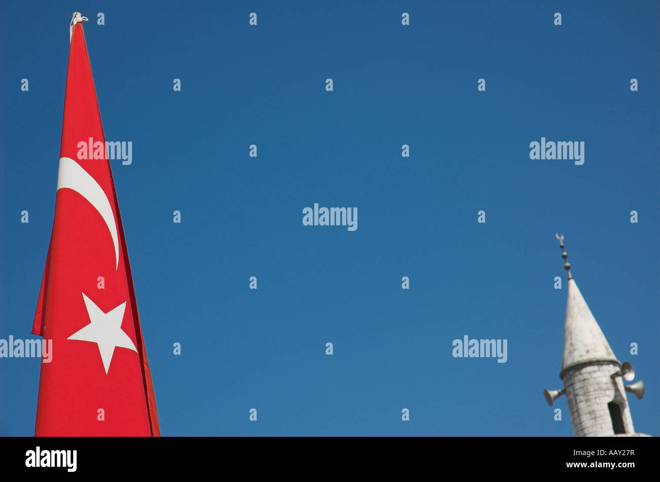 Turkish flag on a still day mimics shape of the minaret of an Islamic ...