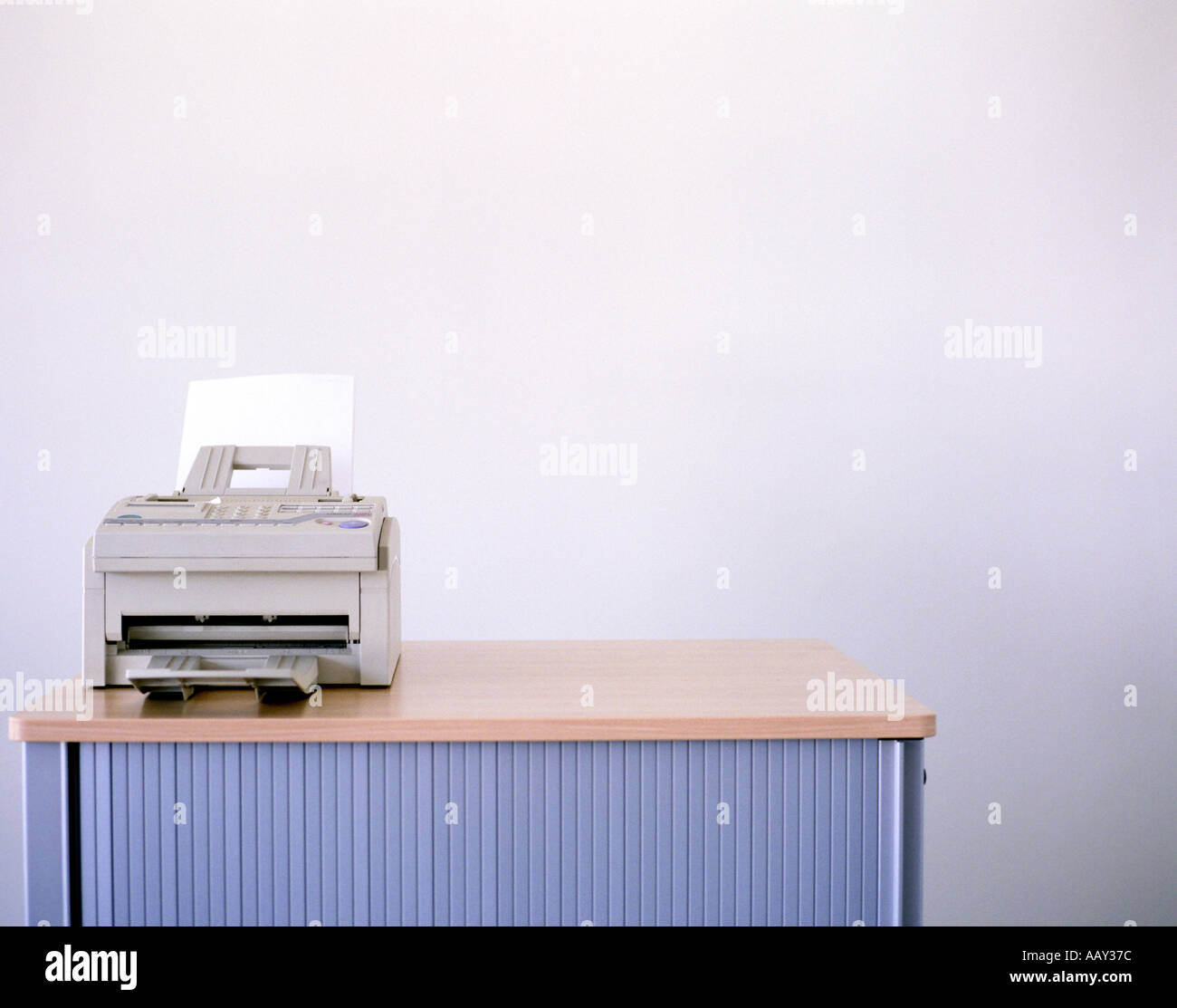 grey fax machine on horizontal office sideboard white background Stock ...