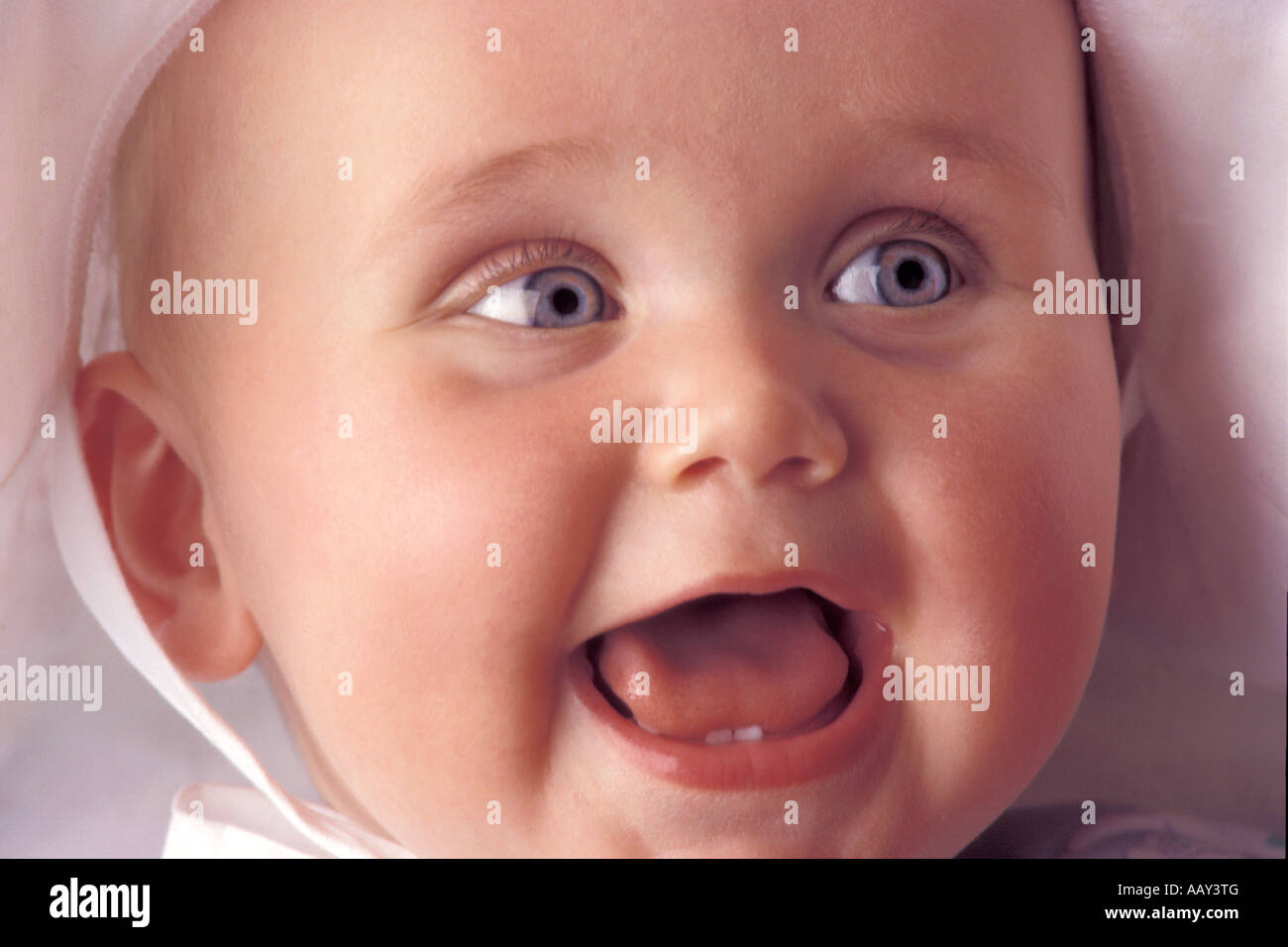 happy baby face showing two front teeth and a happy expression on face ...