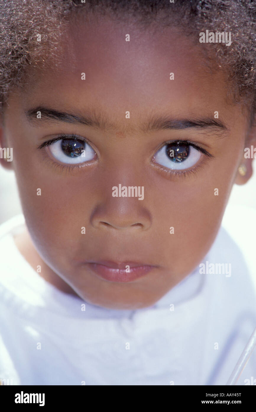 young pretty black girl with sad look on face and big beautiful eyes ...