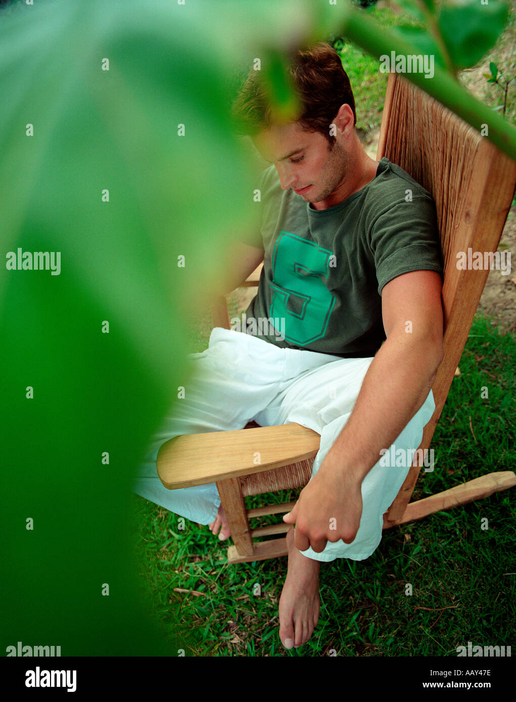 Man relaxing on rocking chair hi-res stock photography and images - Alamy