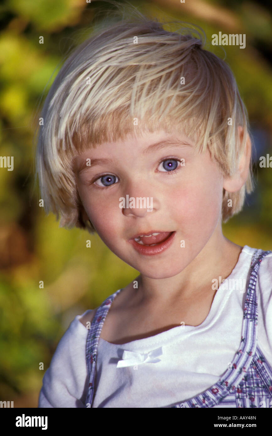 portrait of a sweet adorable cute little kid child with happy ...