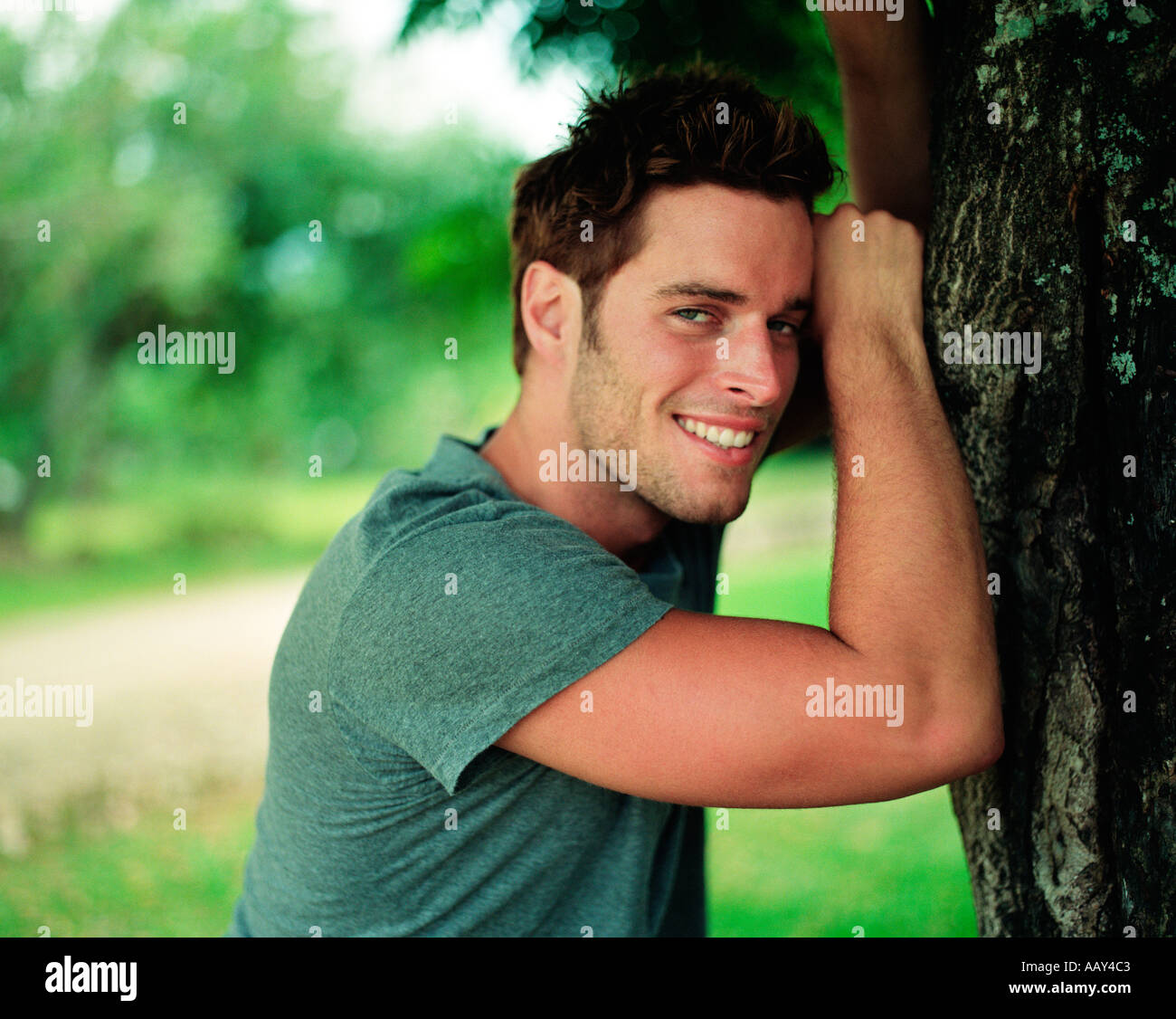 Man pose against tree hi-res stock photography and images - Alamy
