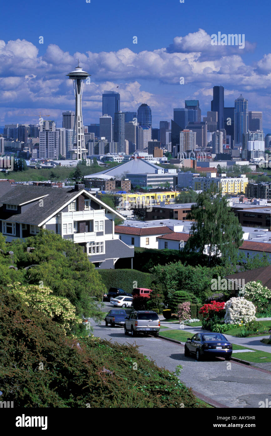 homes and houses in a Seattle neighborhood with the Seattle Skyline and ...