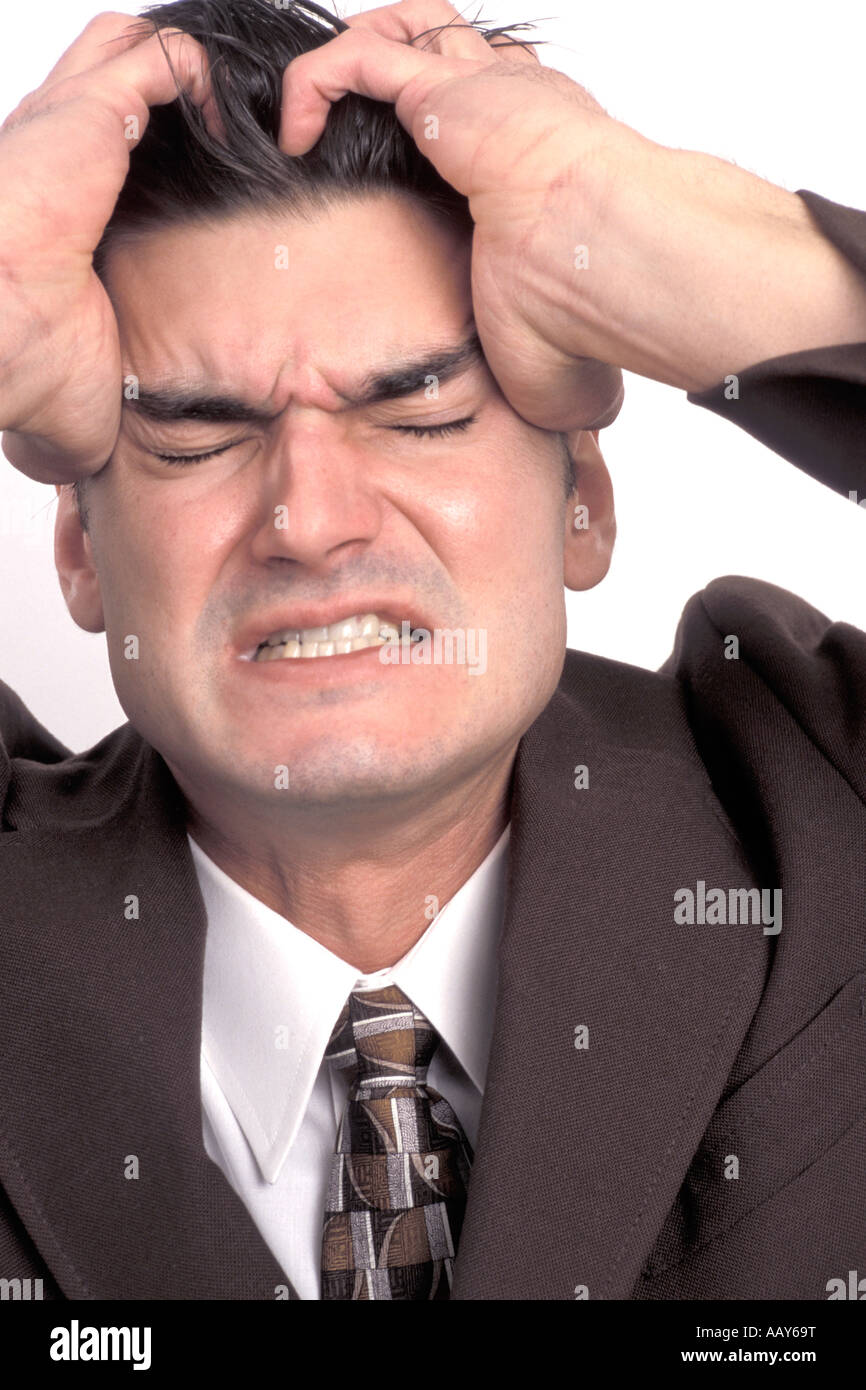 business man with tension headache and big problems that are causing ...