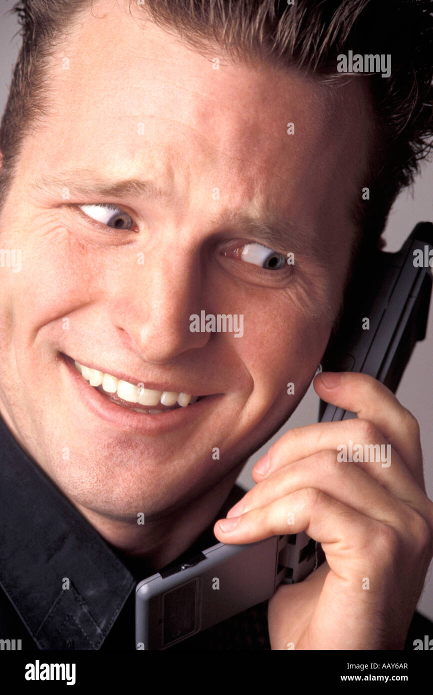 Happy man talking on phone Stock Photo - Alamy
