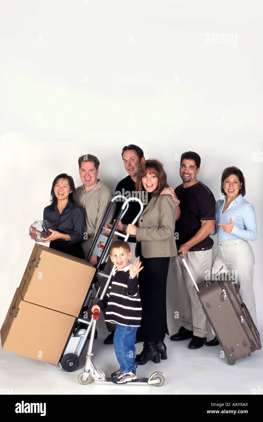 group of happy people and couples with packed boxes and suitcases ...