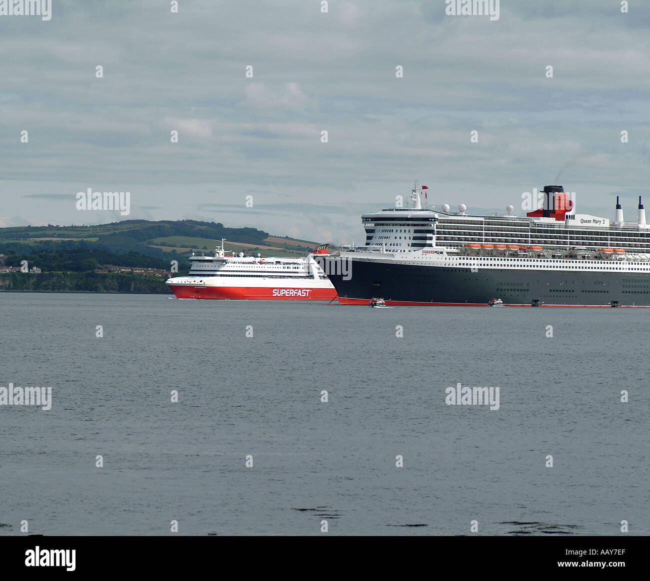 Queen Mary Two QM2 with Superfast Ferry Stock Photo - Alamy