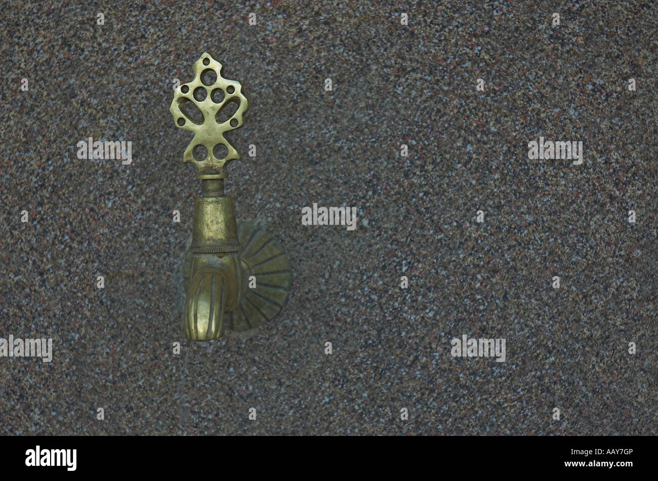Tap for washing at entrance to Islamic mosque Stock Photo - Alamy