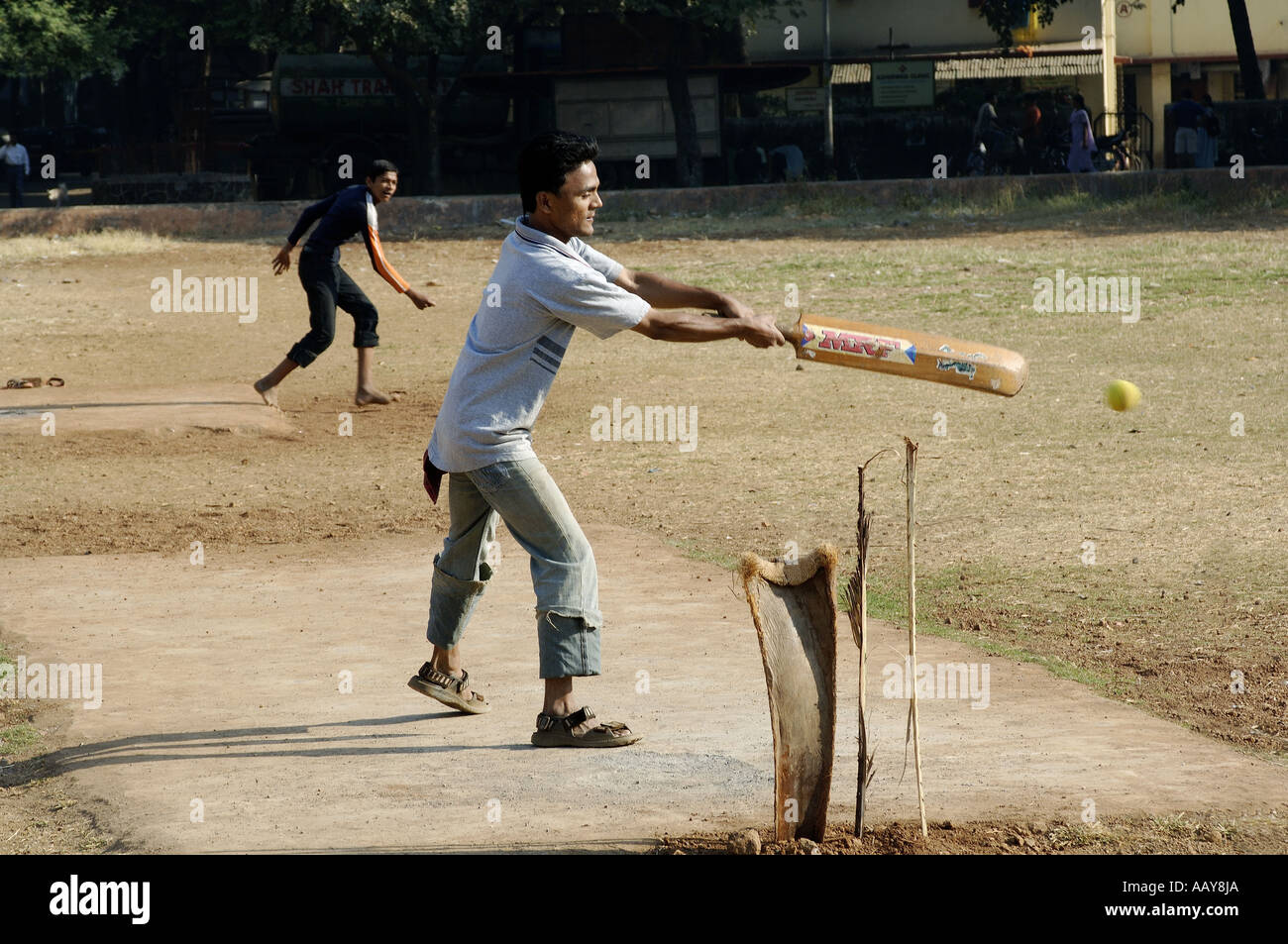 HMA78720 Indian children playing cricket in playground Stock Photo - Alamy
