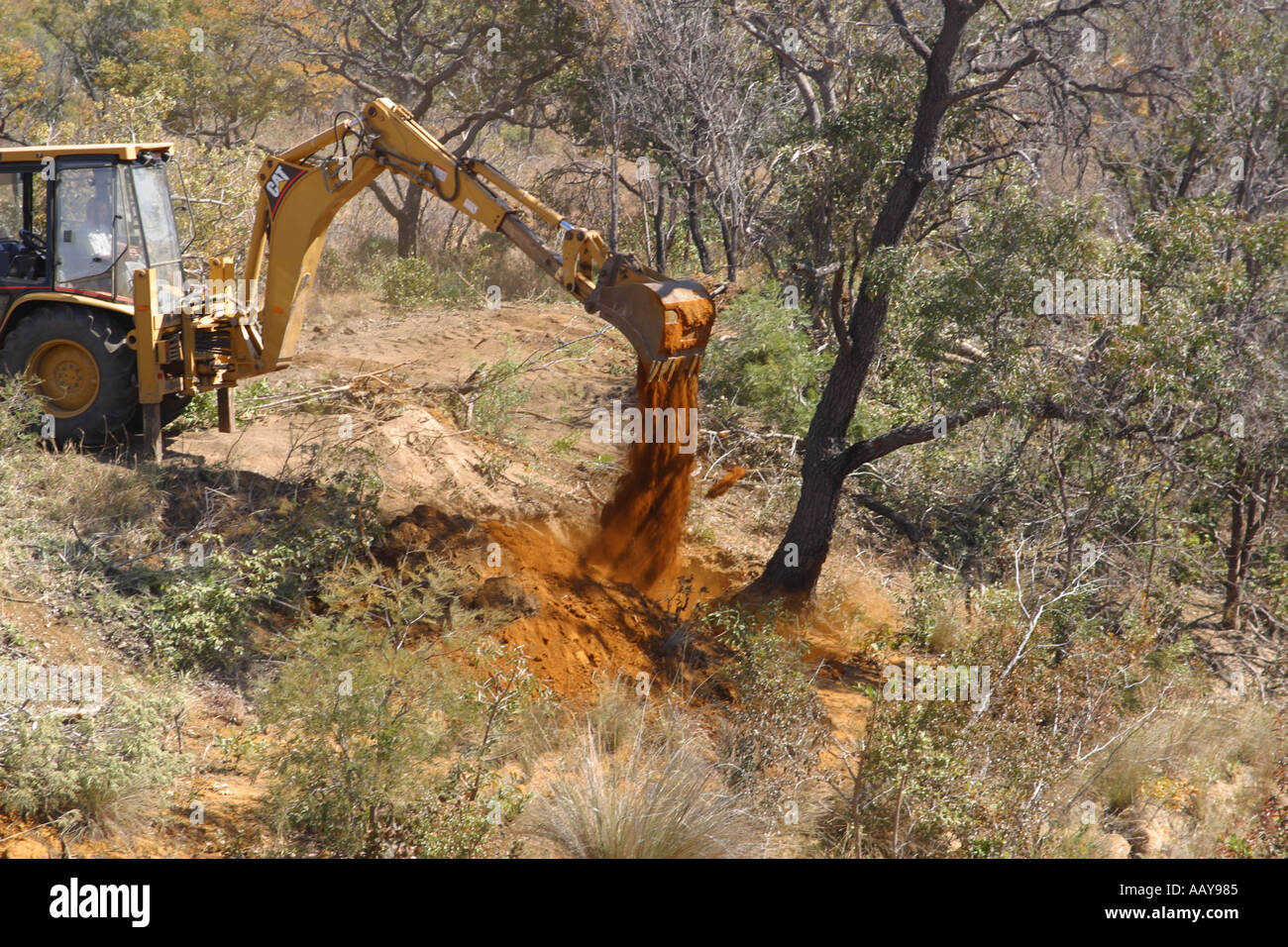 Earthmoving excavating tractor tlb Stock Photo - Alamy