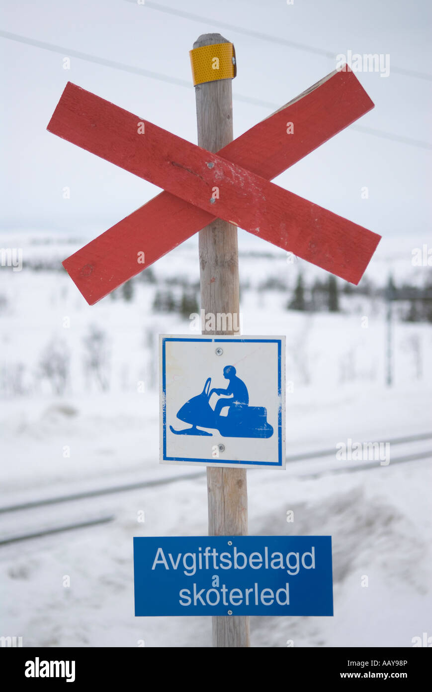 Snowmobile route railway crossing Stock Photo - Alamy
