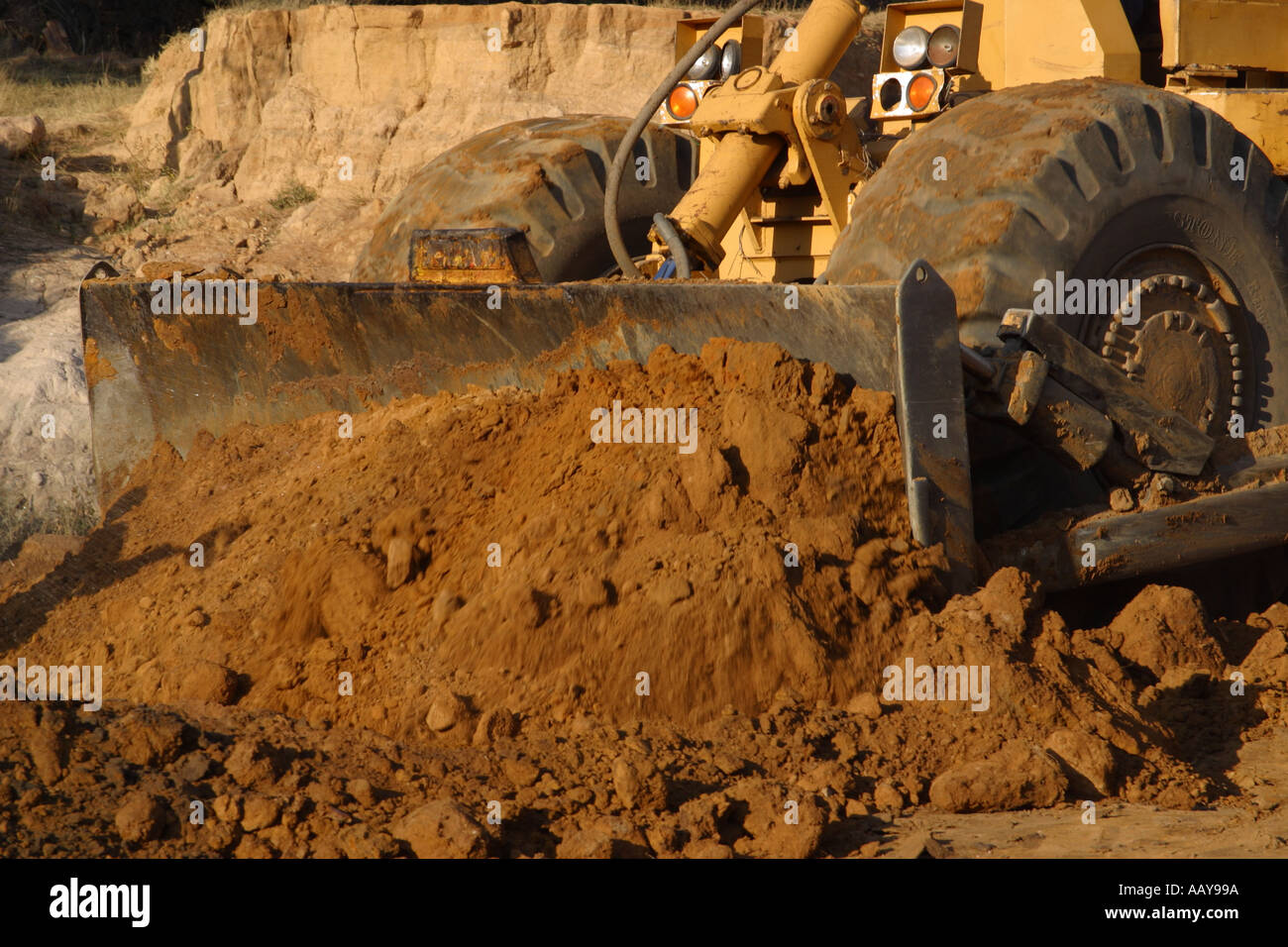 Earthmoving excavating bulldozer tractor Stock Photo - Alamy