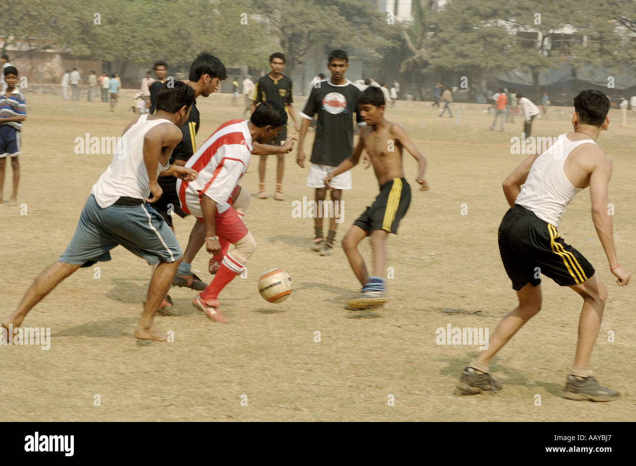 HMA78761 Indian boys playing football on playground Bombay Mumbai ...