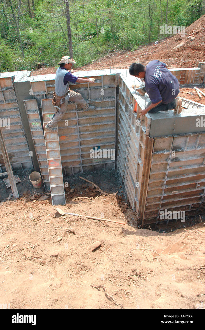 Taking down steel re usable house construction foundation forms by ...