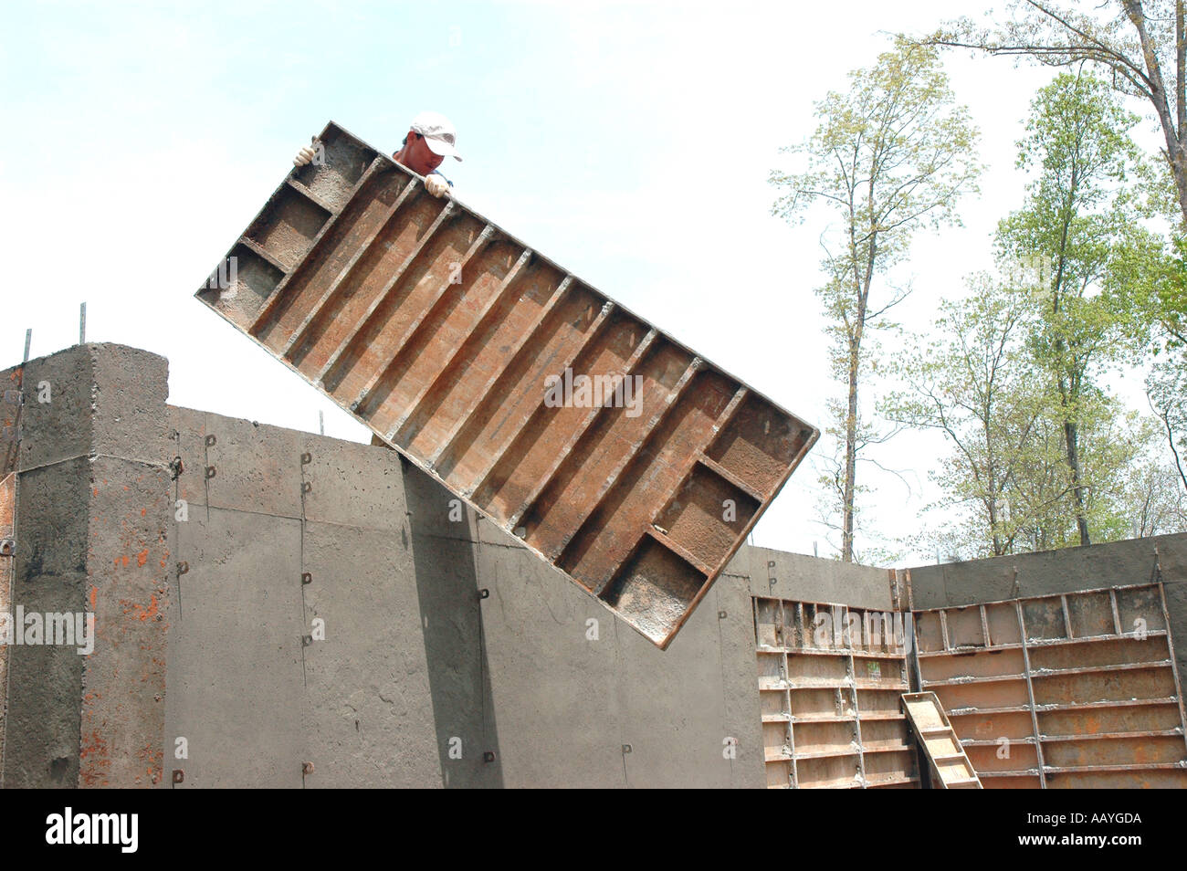 Taking down steel re usable house construction foundation forms by ...