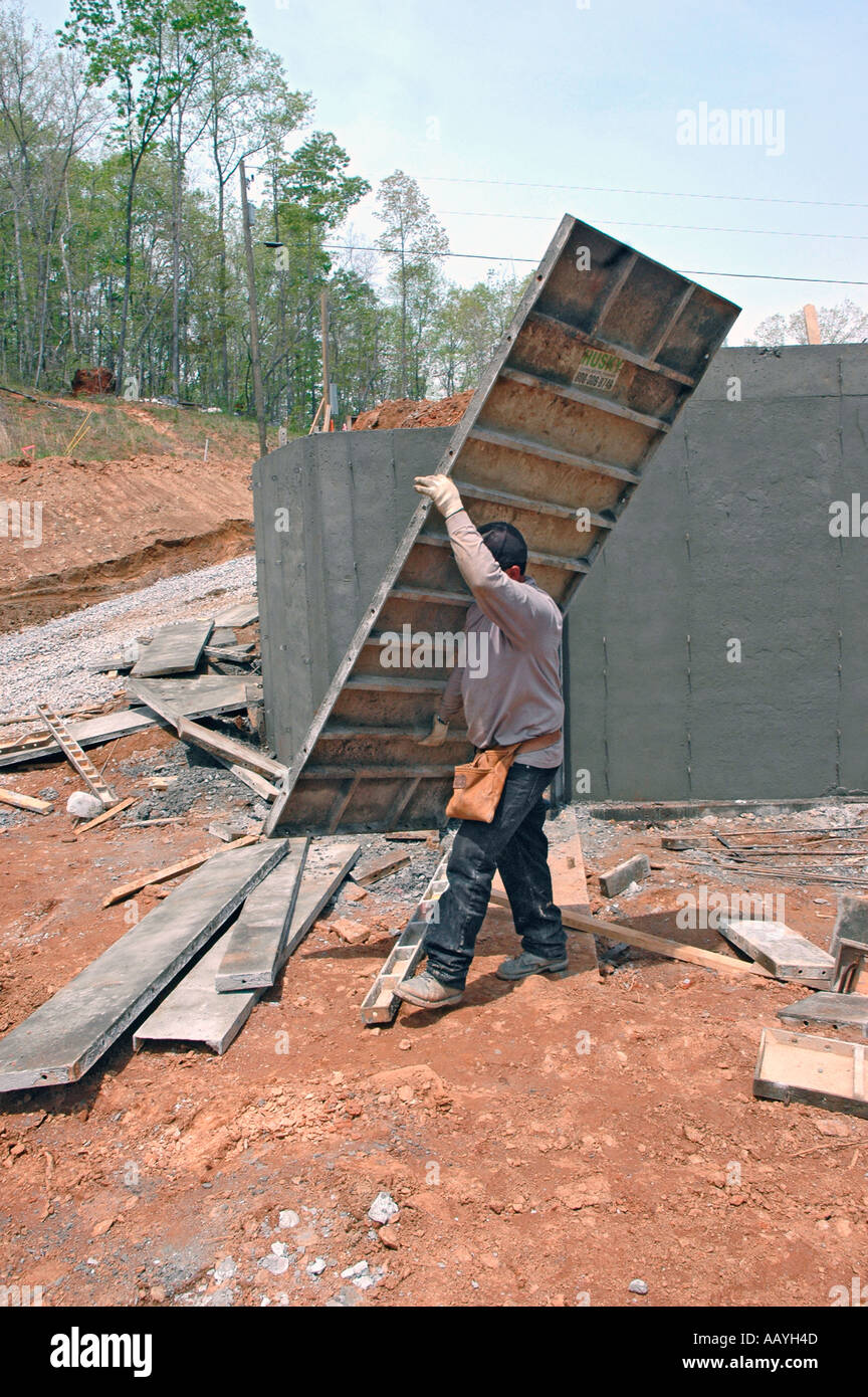 Putting in Cement footings for walls of new house by Latin labor ...