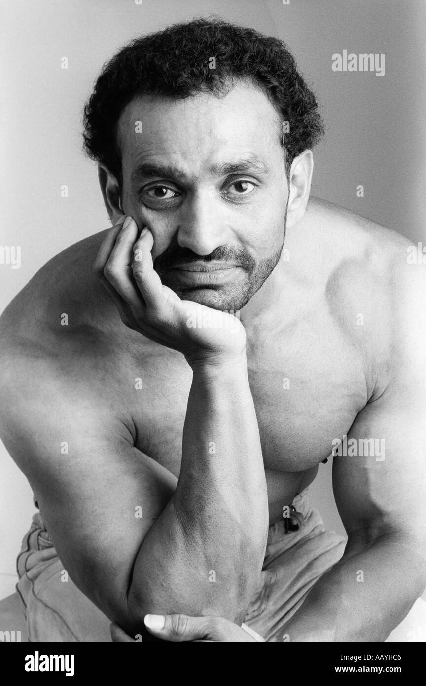 Bodybuilder with hand on chin - Model Release Number 624 Stock Photo ...