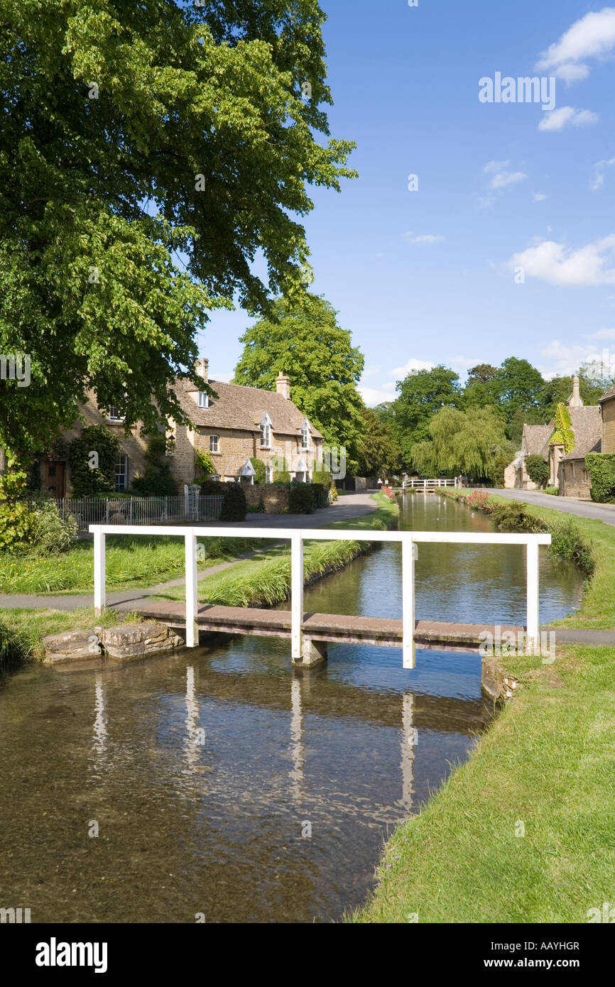 The River Eye flowing through the Cotswold village of Lower Slaughter ...