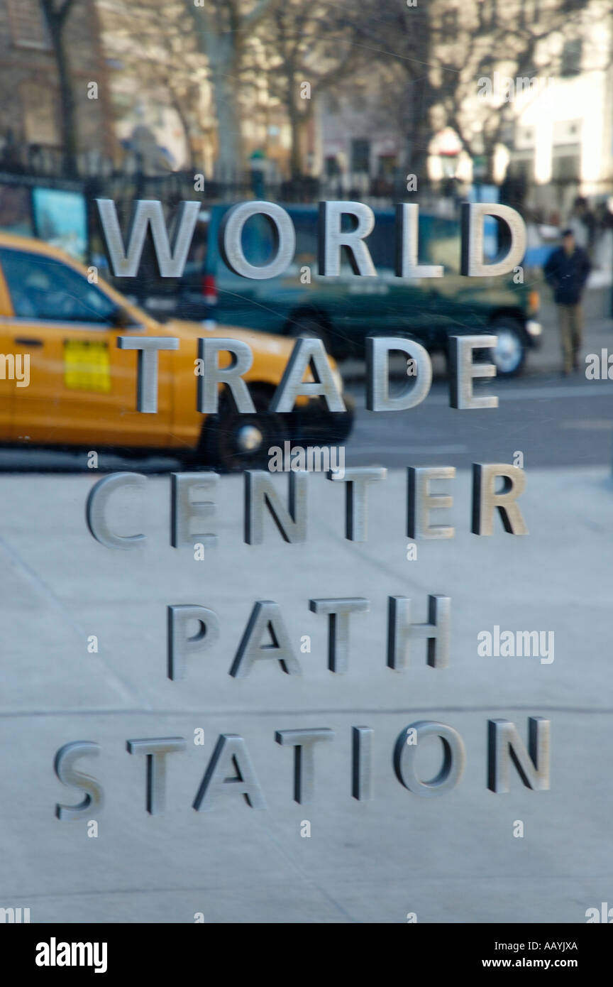 Yellow taxi cab reflected in sign for World Trade Center Path train ...