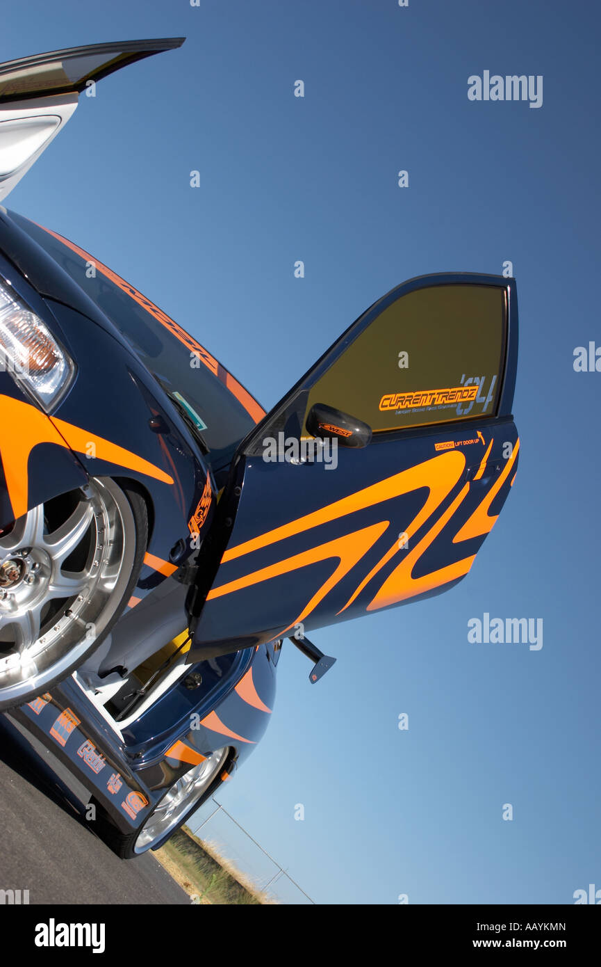 artistic slanted photography angle on the gull wing door of a tuned and ...