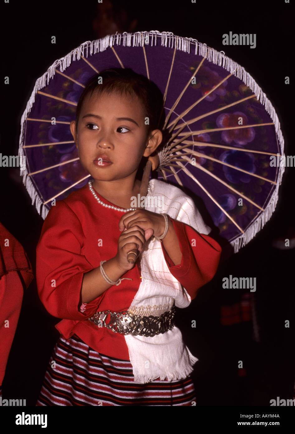 Thailand Chaing Mai Young girl in traditional dress at Umbrella ...