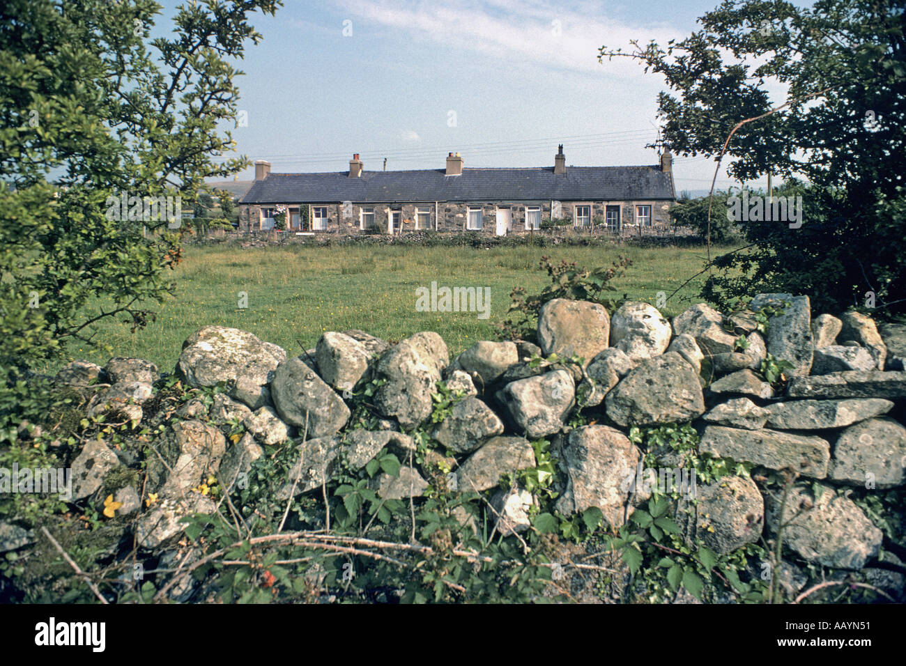 Terrace of welsh stone cottages with slate roofs at Llain Ffynnon ...