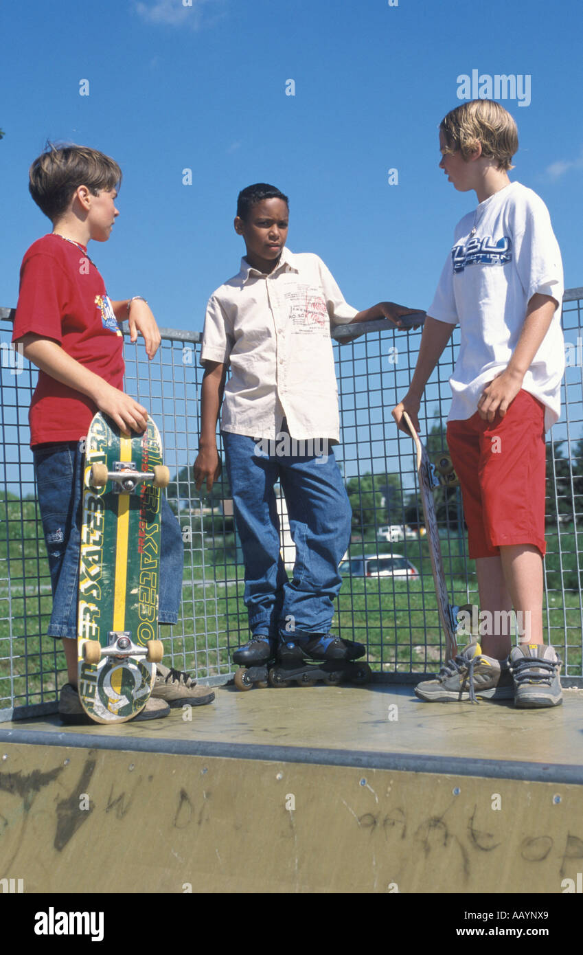 3 Teenage boys talking together Stock Photo - Alamy