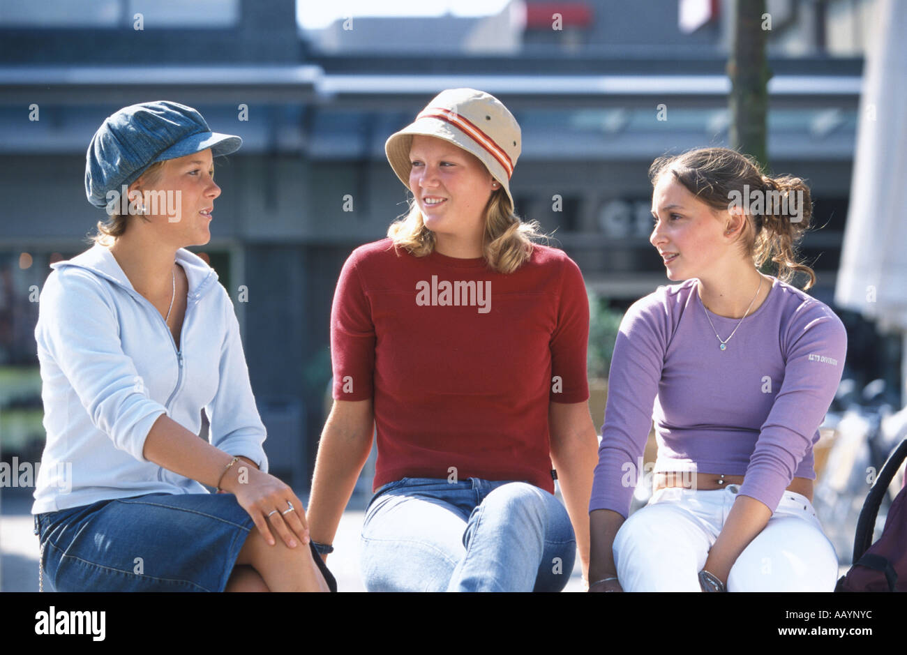 3 Teenage girls talking together Stock Photo - Alamy