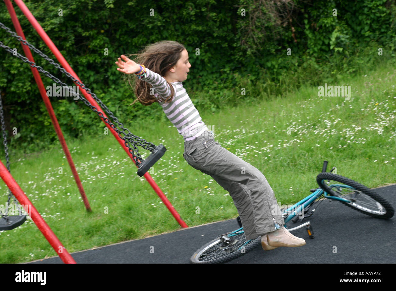girl jumping from swing in recreation ground Stock Photo - Alamy