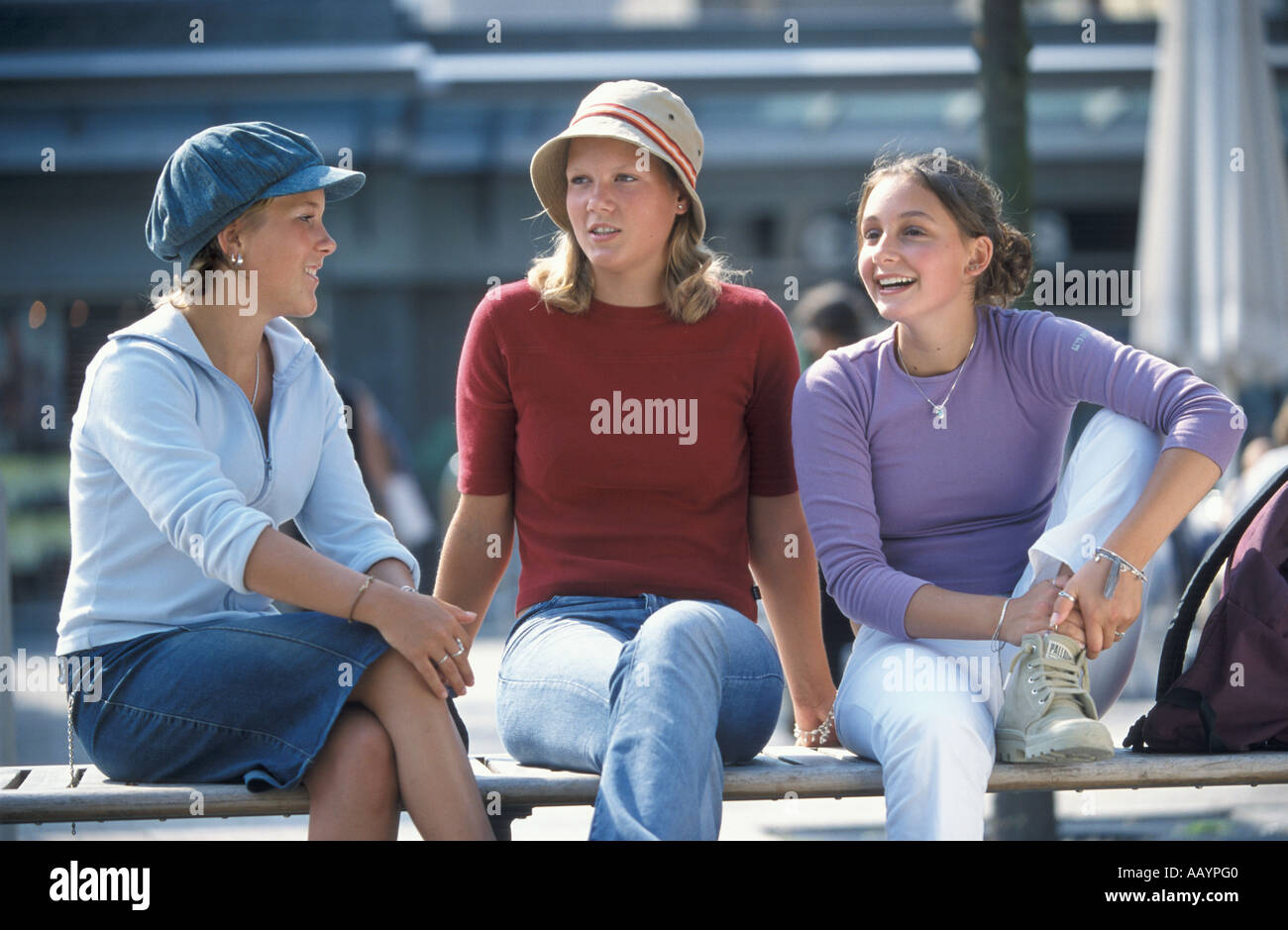 3 Teenage girls talking together Stock Photo - Alamy