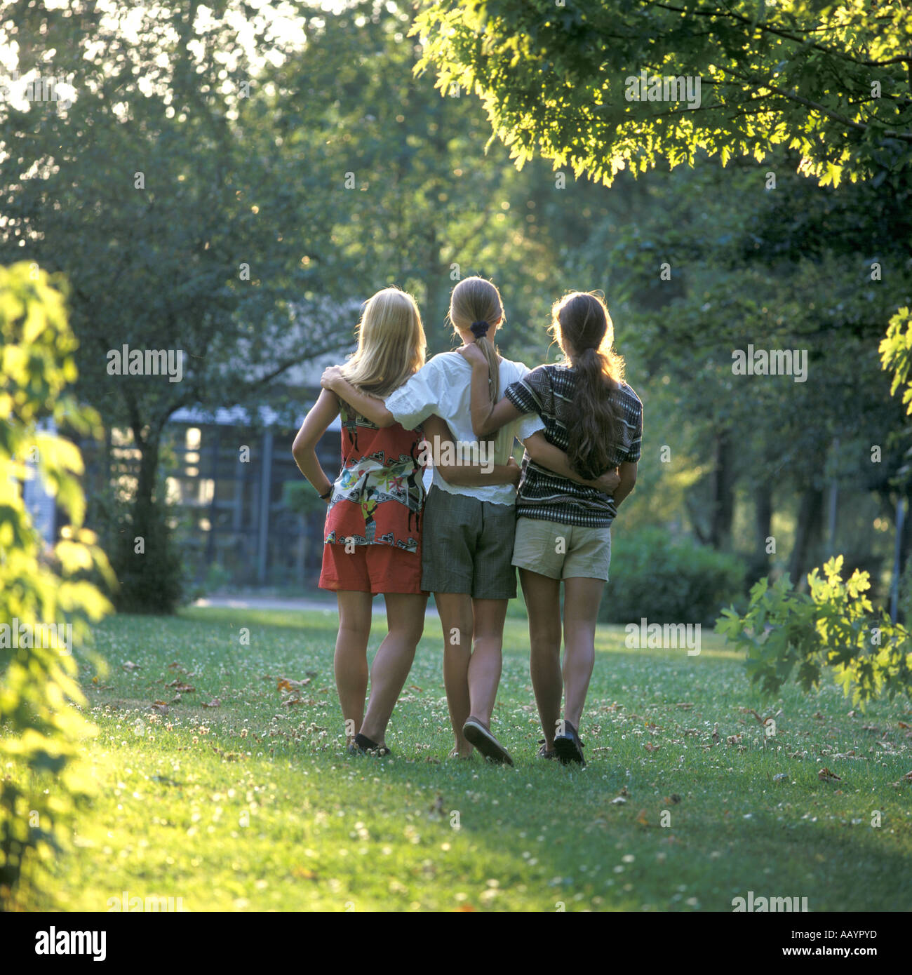 Backview of three teenage girls Stock Photo - Alamy