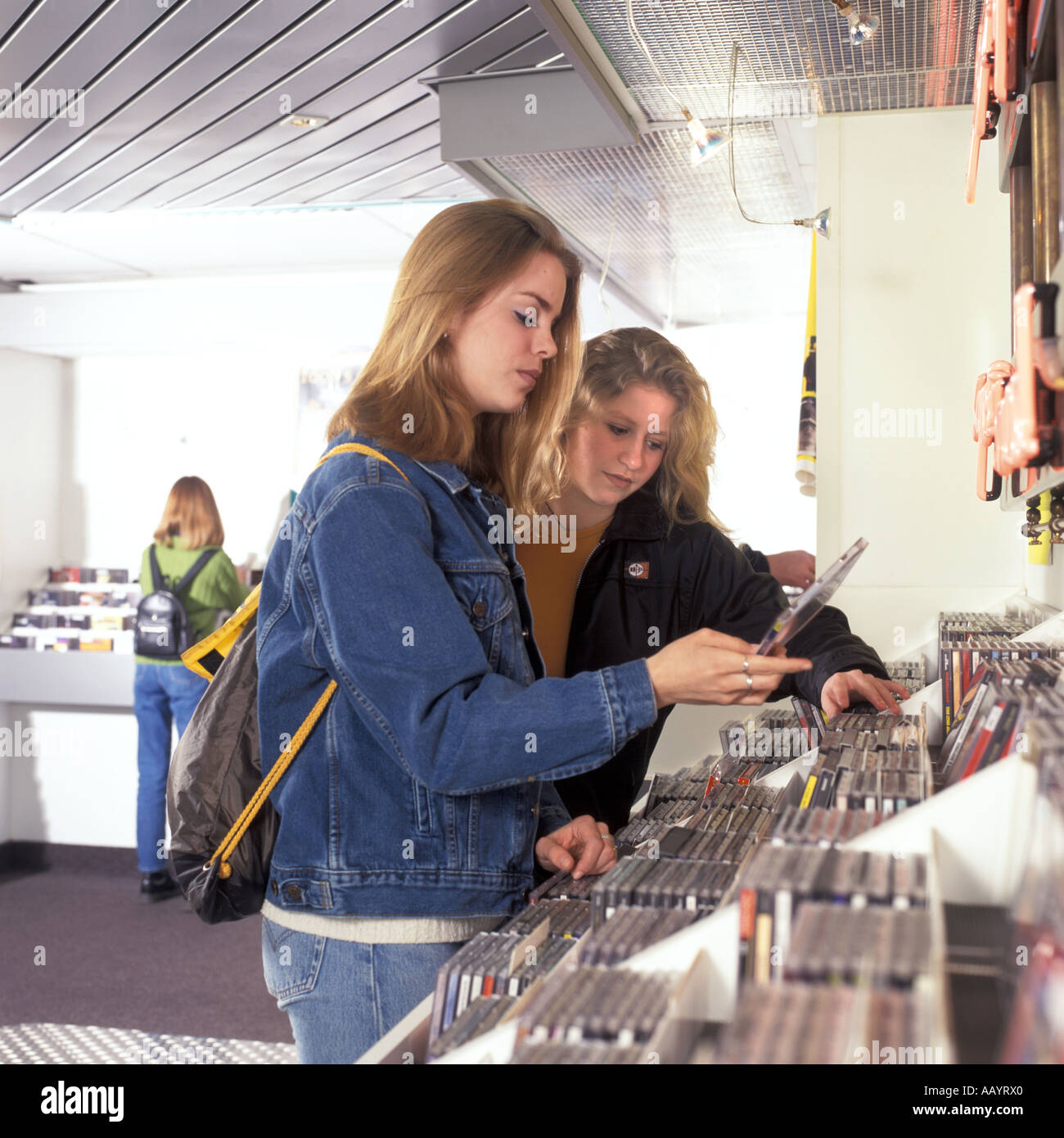 Teenage girls in DVD shop Stock Photo - Alamy