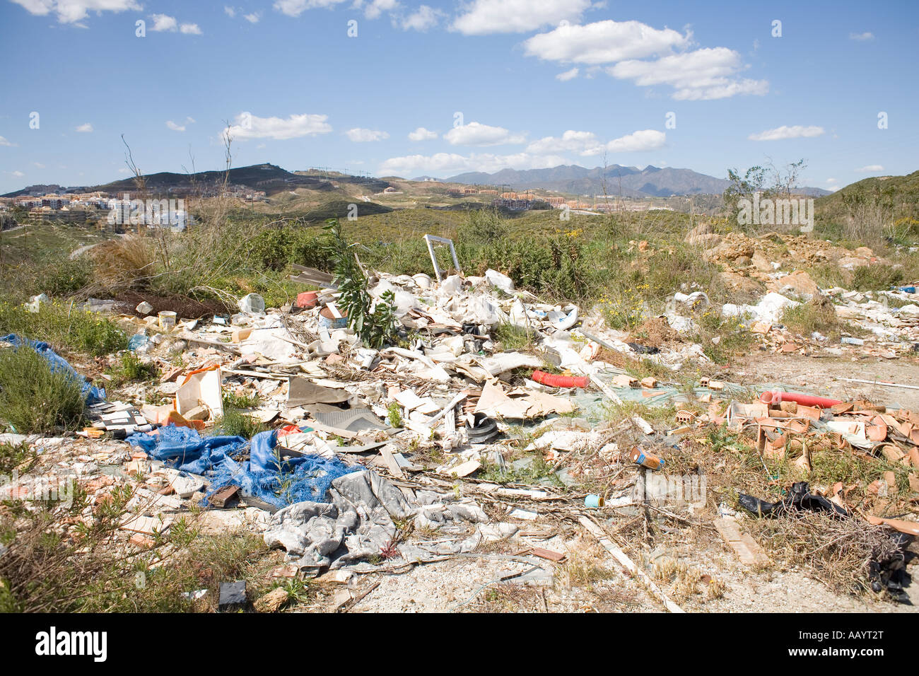 Dirty Spain, rubbish, car parts, oil cans, and builders rubble, dumped ...
