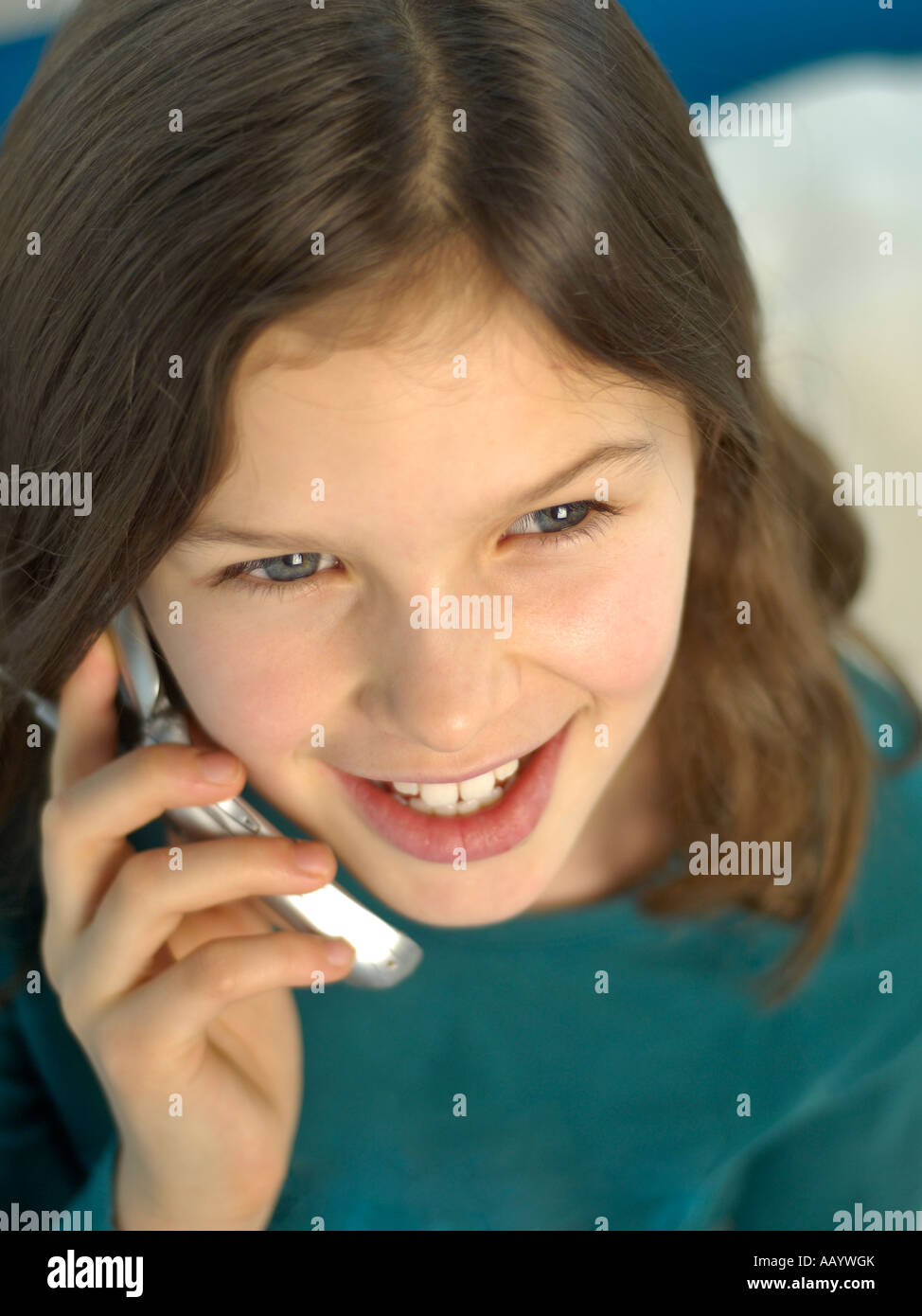 Tween talking on a cell phone Stock Photo - Alamy